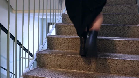 Female feet walking fast upstairs on a c... | Stock Video | Pond5