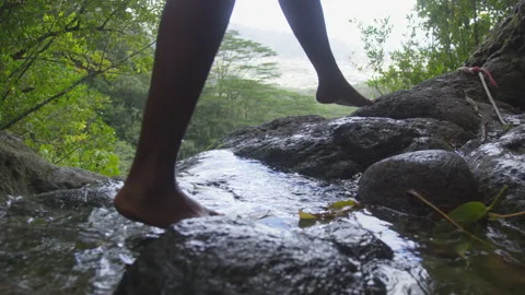 Female Feet Walking Through a Stream and... | Stock Video | Pond5