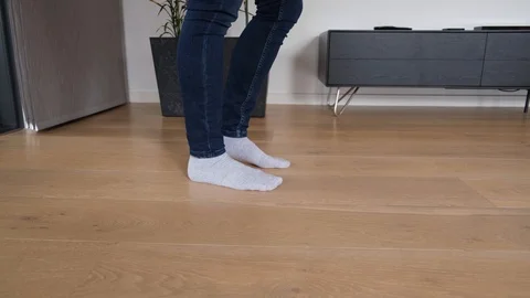 Female feet in white socks walking on ti... | Stock Video | Pond5