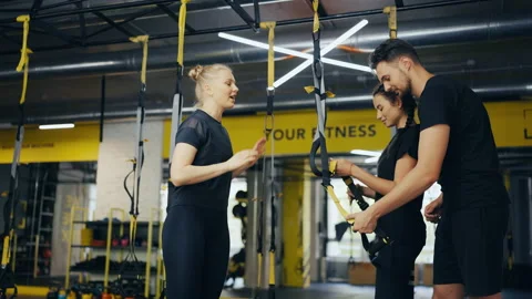 Female fitness trainer explaining how to... | Stock Video | Pond5