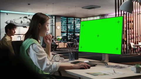 Female Game Designer Using Chromakey Com... | Stock Video | Pond5