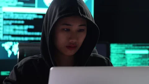 Female Hacker In A Hood Looking Laptop W... | Stock Video | Pond5