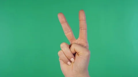 Female hand flashes peace sign fingers. ... | Stock Video | Pond5