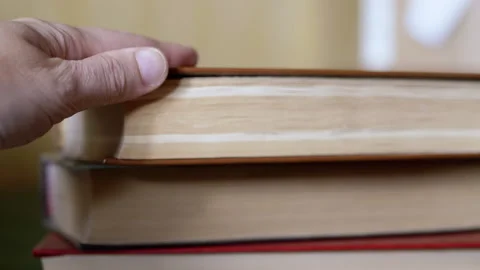 Female Hand Flipping through the Pages o... | Stock Video | Pond5