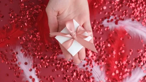 Female hand giving gift box, present on ... | Stock Video | Pond5