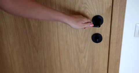 Female hand opening wooden door by handl... | Stock Video | Pond5
