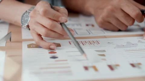 Female Hand Pointing at Bar Chart with P... | Stock Video | Pond5