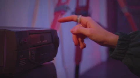 Female Hand Putting Cassette into VHS Pl... | Stock Video | Pond5