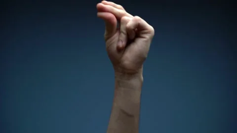 Female hand with snapping fingers on blu... | Stock Video | Pond5