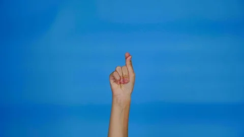 Female hand snaps her fingers on blue ba... | Stock Video | Pond5