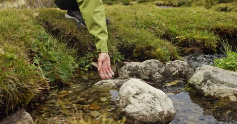 Female hand touching fresh spring water ... | Stock Video | Pond5