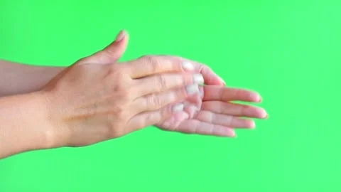 Female Hands are clapping on green scree... | Stock Video | Pond5