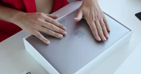 Female hands getting new laptop Apple Ma... | Stock Video | Pond5