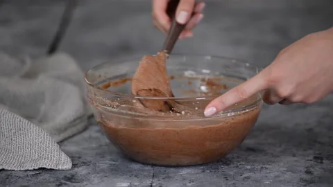 Female hands mixing the chocolate batter... | Stock Video | Pond5