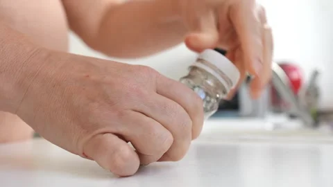 Female hands squeezing plastic bottle | Stock Video | Pond5