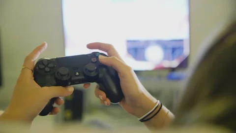Female hands using black PS4 dualshock c... | Stock Video | Pond5