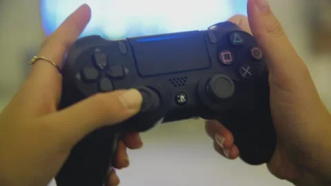 Female hands using black PS4 dualshock c... | Stock Video | Pond5