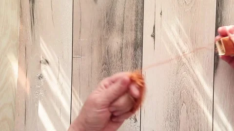 Female hands wind hands wind a copper wi... | Stock Video | Pond5