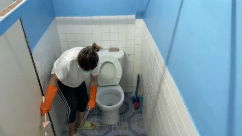 Female housekeeper cleaning bathroom and... | Stock Video | Pond5