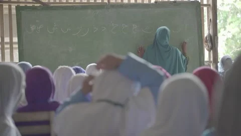A female Imam at an Islamic School in Ma... | Stock Video | Pond5