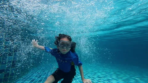 Female kid running and jump to the Swimm... | Stock Video | Pond5