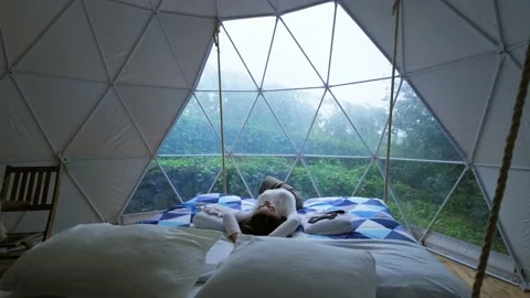 Female laying on a rocking bed and relax... | Stock Video | Pond5