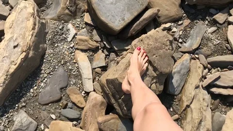 Female legs barefoot walking stones shor... | Stock Video | Pond5