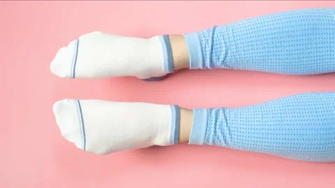 Female legs in socks bend and unbend fee... | Stock Video | Pond5