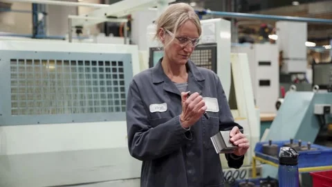 Female machine shop worker and superviso... | Stock Video | Pond5
