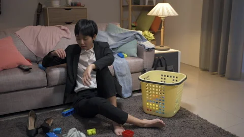 female manager sitting barefooted on flo... | Stock Video | Pond5