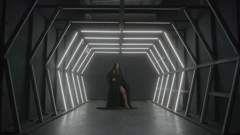 Female Model in Black Dress Poses on an ... | Stock Video | Pond5