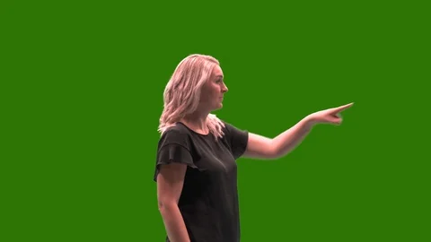 Female model on green screen pointing to... | Stock Video | Pond5