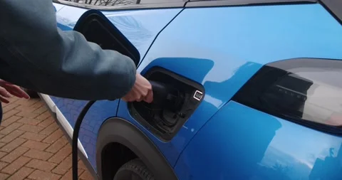 female model opening charging flap and p... | Stock Video | Pond5