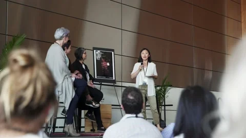 Female moderator leading panel Q and A o... | Stock Video | Pond5