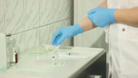 Female nurse preparing medication for in... | Stock Video | Pond5