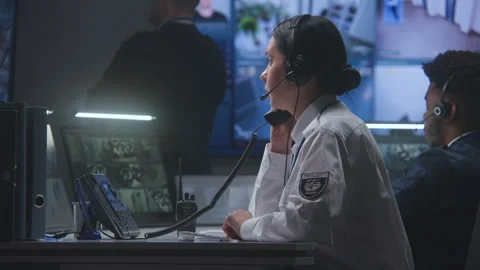 Female officer works on computer in poli... | Stock Video | Pond5