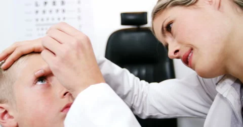 Female optometrist putting eye drop in y... | Stock Video | Pond5