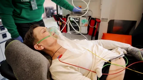 Female patient breathing through oxygen ... | Stock Video | Pond5