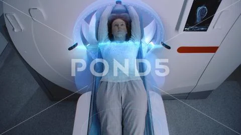 Female patient undergoes MRI or CT scan. Visual effects of scanning ...