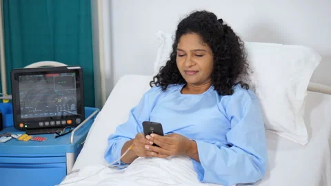 Female patient using mobile phone while ... | Stock Video | Pond5
