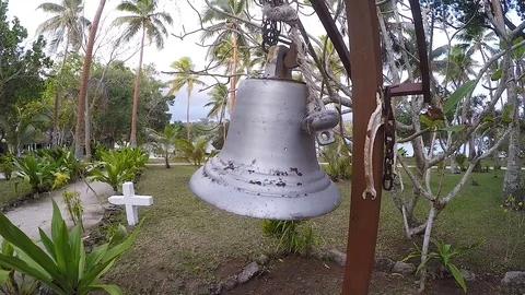 A female person ringing a large bell nea... | Stock Video | Pond5