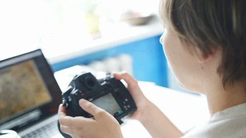 Female photographer reviewing photos on ... | Stock Video | Pond5