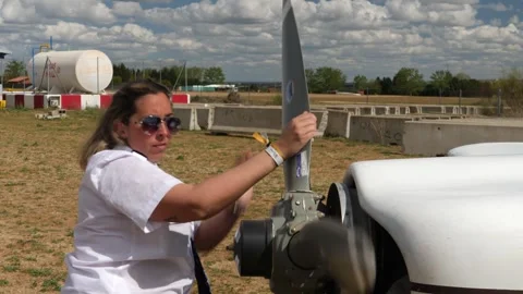 female pilot moving her propeller before... | Stock Video | Pond5
