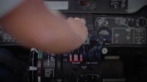 Female pilot touching controls in airpla... | Stock Video | Pond5