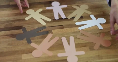 Female placing cut paper figurines in ci... | Stock Video | Pond5