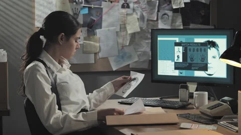 female police detective working at the d... | Stock Video | Pond5