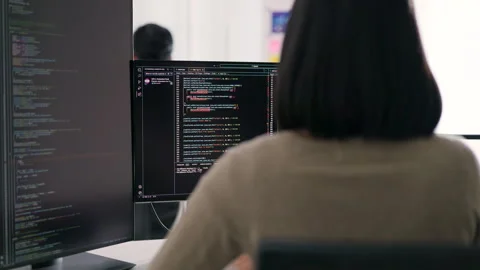 Female Programmer Analyzing Code. | Stock Video | Pond5