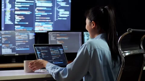 Female Programmer Drinking Coffee Writ... | Stock Video | Pond5