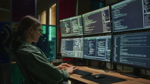 Female Programmer Using Multiple Display... | Stock Video | Pond5