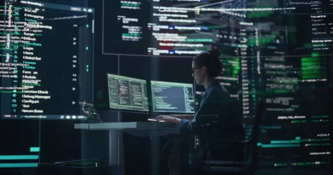 Female Programmer Writing Code Surrounde... | Stock Video | Pond5